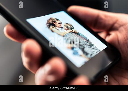 Sad man looking at his phone Stock Photo - Alamy