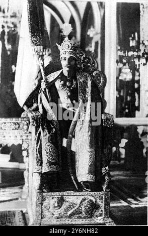 Wearing the crown specially made for his own coronation and holding his ...