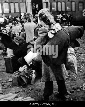 World War 2 Child refugee evacuees. Young girl on the railway station ...
