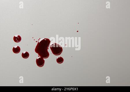 Drops of blood on grey background, top view Stock Photo - Alamy