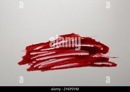 Stain of blood on grey background, top view Stock Photo - Alamy