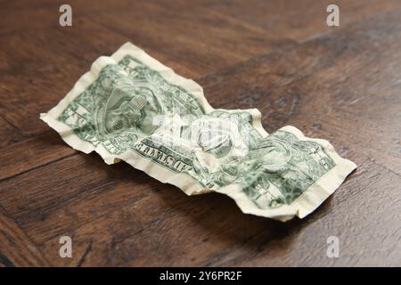 One crumpled dollar banknote on grey table, top view Stock Photo - Alamy