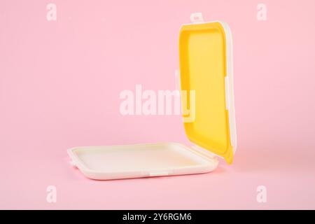 Empty sandwich lunch box on light blue background, top view. Space for ...