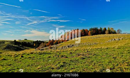 Lessinia plateau. Autumn panorama over the pastures and mountain huts ...
