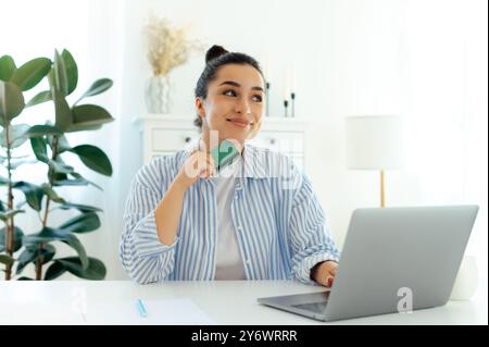 Indian female spend money online using plastic card mobile phone Stock ...