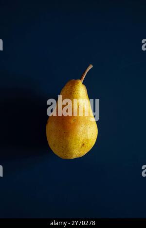 Top-down close-up of a ripe red tomato cut in half, one half showing ...