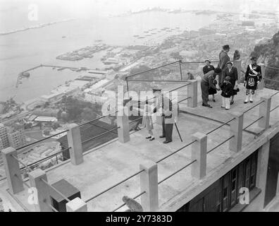 Princess Anne seen handing a nut to one of the apes while others get ...