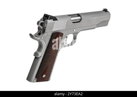 Silver pistol with a wooden handle. Short-barreled weapon. Modern semi ...