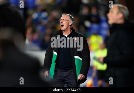 Tranmere Rovers manager Nigel Adkins crosses his arms on the touchline ...