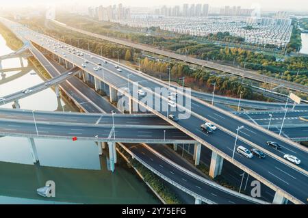 Aerial view of interconnected highways with traffic in a suburban area ...