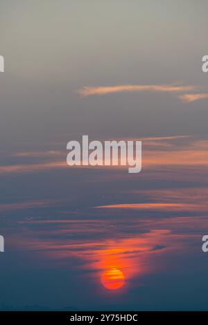 The slowly disappearing into cloud over the Welsh coast at sunset Stock ...