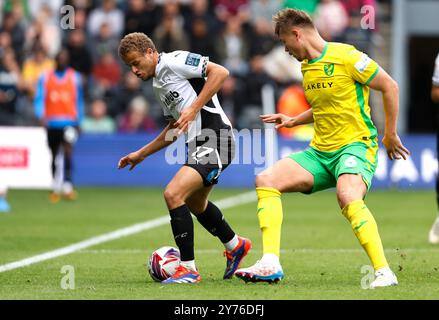 Norwich City's Callum Doyle (left) and Derby County's Kenzo Goudmijn ...