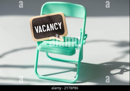 vacancy word is made of wooden blocks lying on the table, concept ...