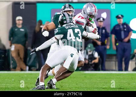Ohio State receiver Carnell Tate plays against Ohio during an NCAA ...