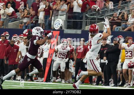 Arkansas wide receiver Isaac TeSlaa stretches before lifting weights at ...
