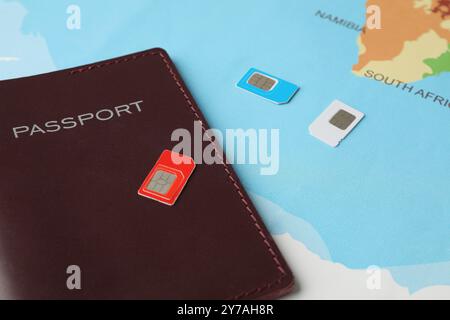 Passport and SIM cards on world map Stock Photo - Alamy
