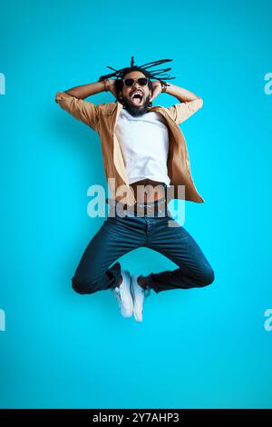 Keeping fashion fun. Studio shot of a beautiful young woman posing ...