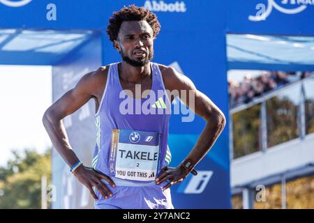 Tadese Takele of Ethiopia reacts after crossing the finish line during ...