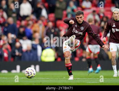 Manuel Ugarte of Manchester United warms up ahead of the Premier League ...
