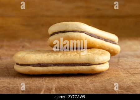 Traditional Romanian biscuits filled with cacao cream on wooden ...
