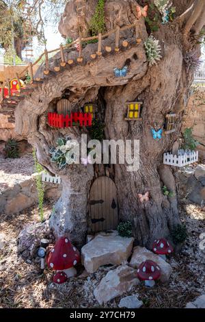 Fairy tree house. Ancient olive tree trunk decorated by created by ...