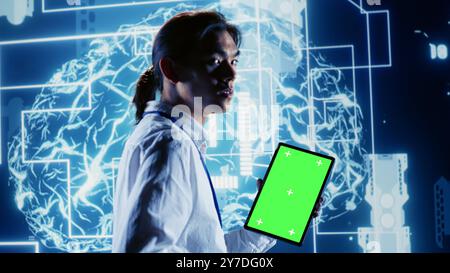 Skillful IT consultant using green screen tablet to implement artificial intelligence parallel ...