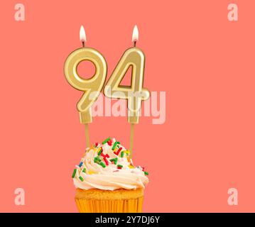 birthday cake with number 94 - cupcake on orange background with ...