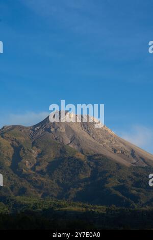 The great Mount Merapi Volcano with clear blue sky in the background ...