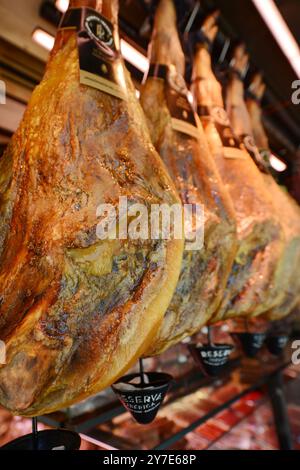 Spanish ham displayed by a shop at the Mercat de la Boqueria in ...