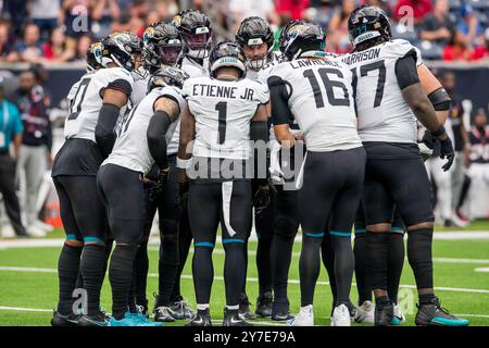 The Houston Texans offense huddles between plays during the second half ...