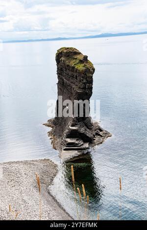 Skinny sea stack on the beach near the Bell on Bell Island ...