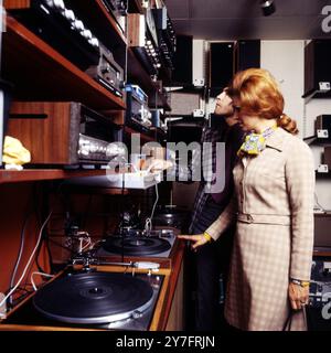 Buying hi-fi equipment in the 1970s Stock Photo - Alamy