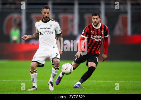 Tete Morente of US Lecce competes for the ball with Mathias Olivera of ...