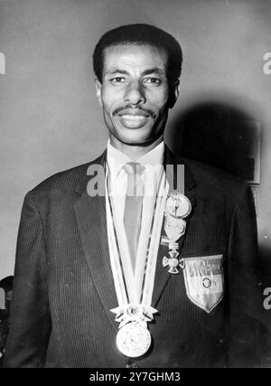 ATHLETE MARATHON WINNER ABEBE BIKILA RIDES FLOAT THROUGH STREETS OF ...