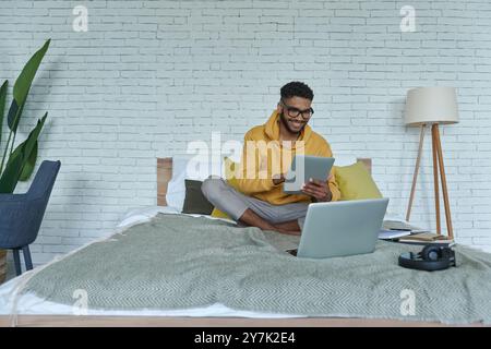 Modern Technologies. Cheerful Young Black Man Using Digital Tablet At ...