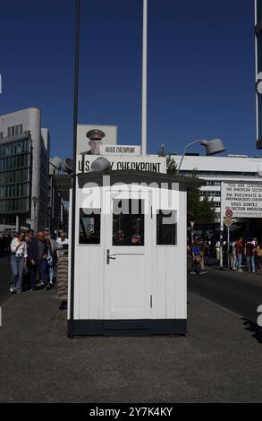 Tourists at a booth and sandbags, a remnant of Checkpoint Charlie on ...
