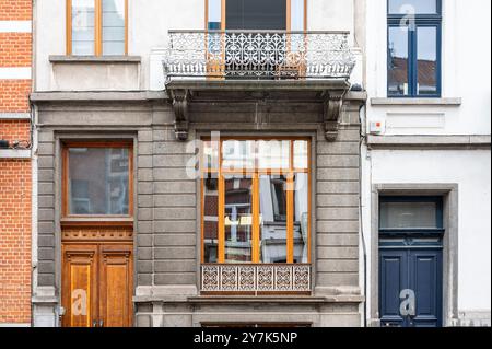 Facades of regular houses in a row in Molenbeek, Brussels, Belgium, SEP ...