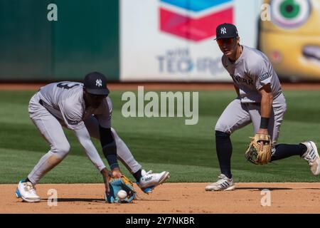 New York Yankees' Jazz Chisholm Jr., left, tags out Athletics Colby ...