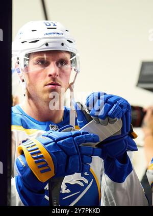 Buffalo Sabres' Sam Lafferty (81) trips Boston Bruins' Oliver Wahlstrom ...
