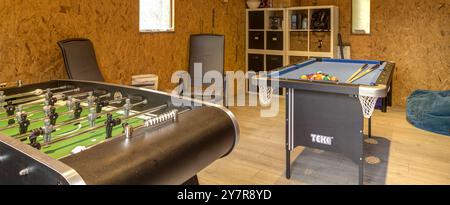 Games room at Rowan Tree Retreats Stock Photo - Alamy
