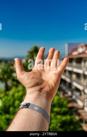 Male hand with all inclusive bracelet against hotel background Stock ...