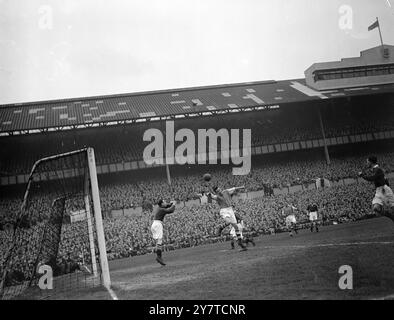 Chelsea goalkeeper Harry Medhurst punches the ball clear of Everton's ...