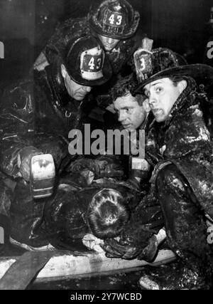Two days after the slaying of Malcolm X, flames engulf the building ...