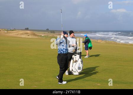 Robert MacIntyre of Scotland hits a shot from a bunker on the 9th hole ...