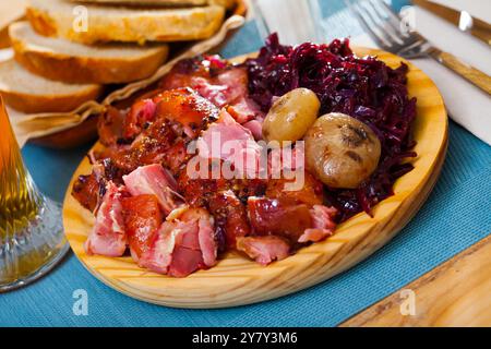 Sliced pork shank with braised cabbage Stock Photo - Alamy