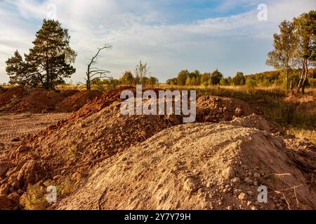 Mounds of soil brought in to level the area Stock Photo - Alamy