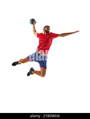 Young focused man, professional handball player in motion during game ...