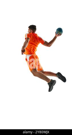Powerful determined man, handball athlete in orange uniform in motion ...