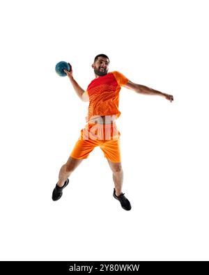 Powerful determined man, handball athlete in orange uniform in motion ...