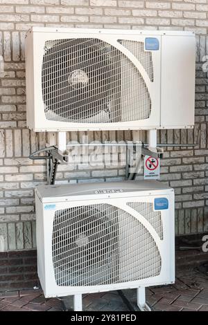 air source heat pump unit installed outdoors at a new home in the ...